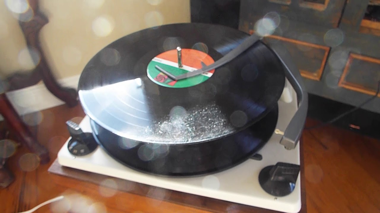 V-M 4 speed, automatic stereo record changer playing an LP - YouTube