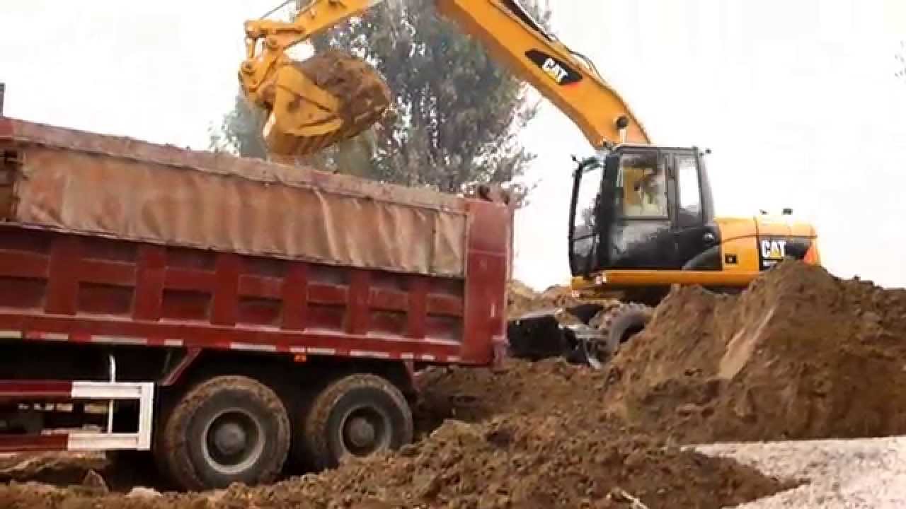 Cat® M315D2 and M317D2 Wheel Excavators in Action - YouTube