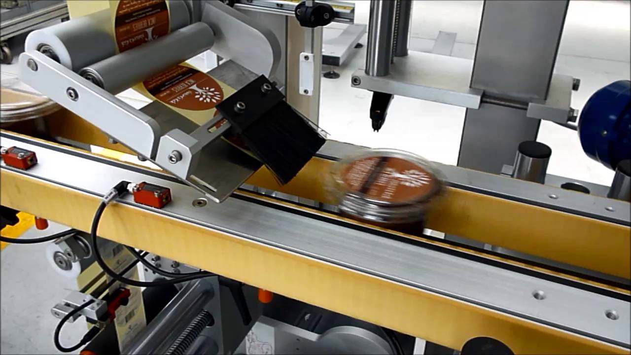 Labelling system for filler plastic cups - YouTube