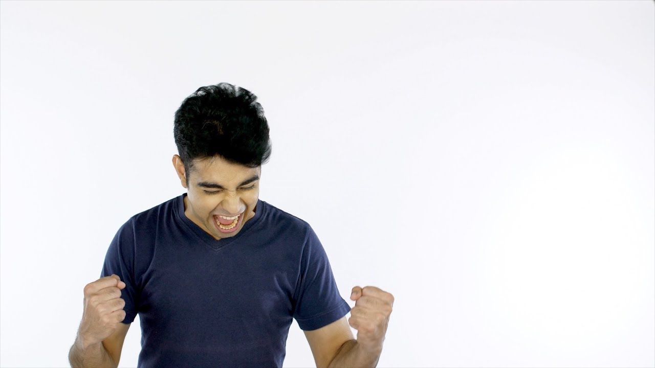 Slow-motion shot of a successful man screaming and enjoying hi ...