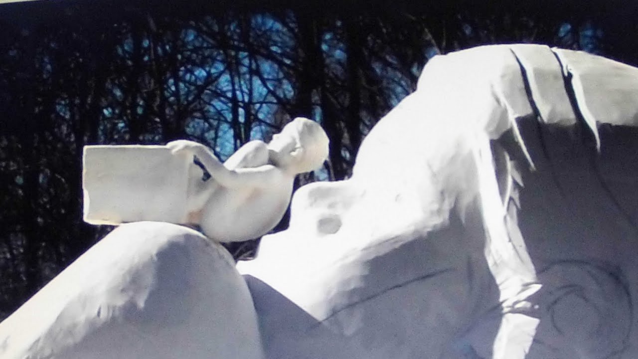 Carving stone Crouching Kid -using the model seeing light and shadow ...