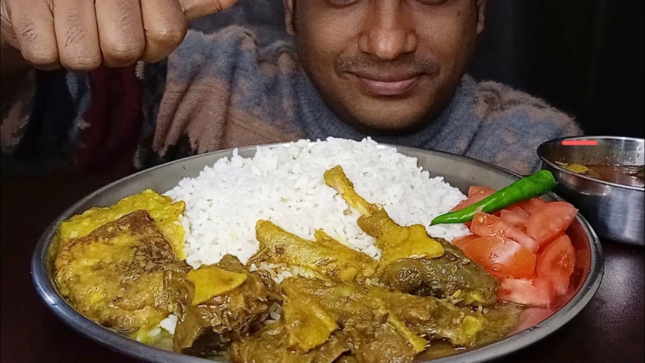 Eating duck curry desi style, egg vaji, alu dal, tomato salad, white ...