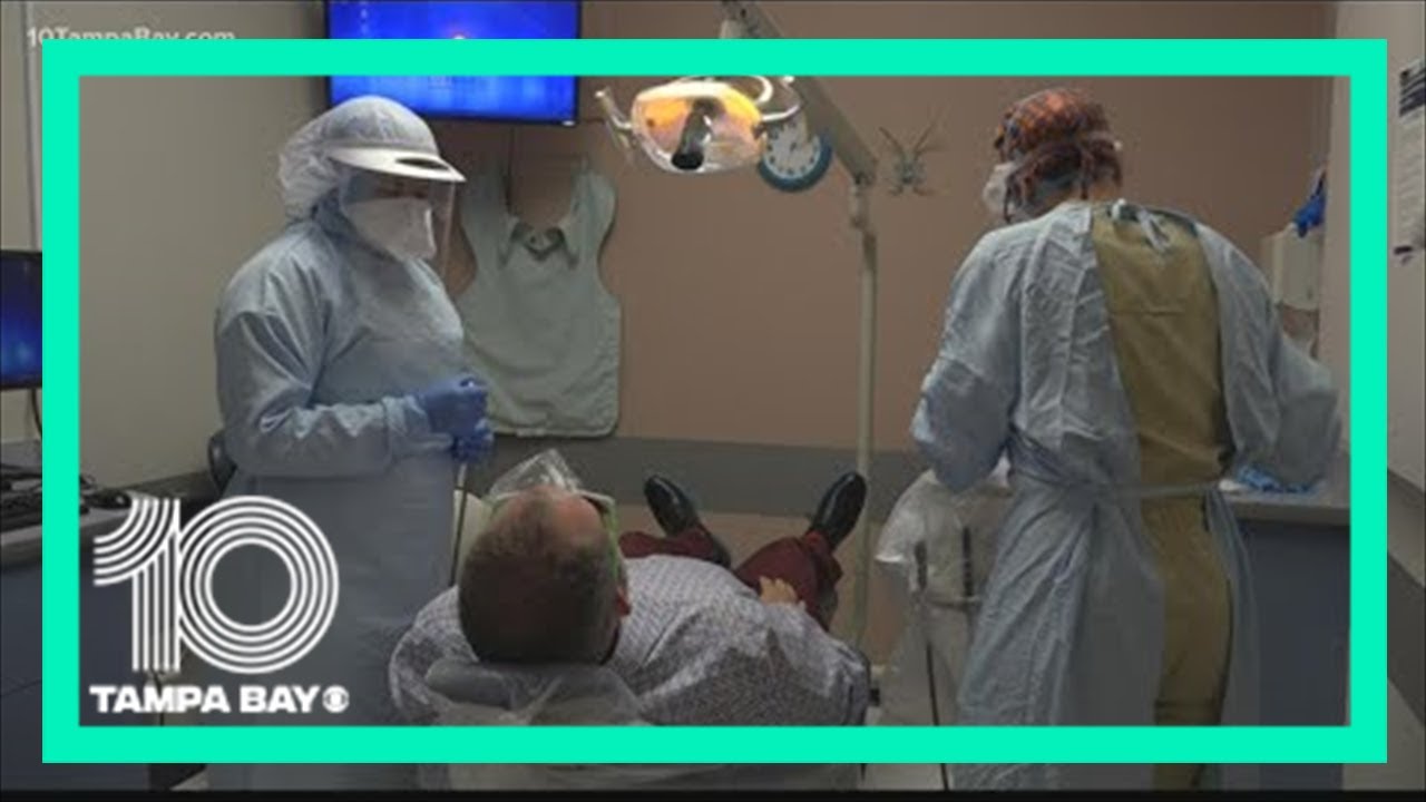 Dentists deal with patient overload as COVID wanes - YouTube