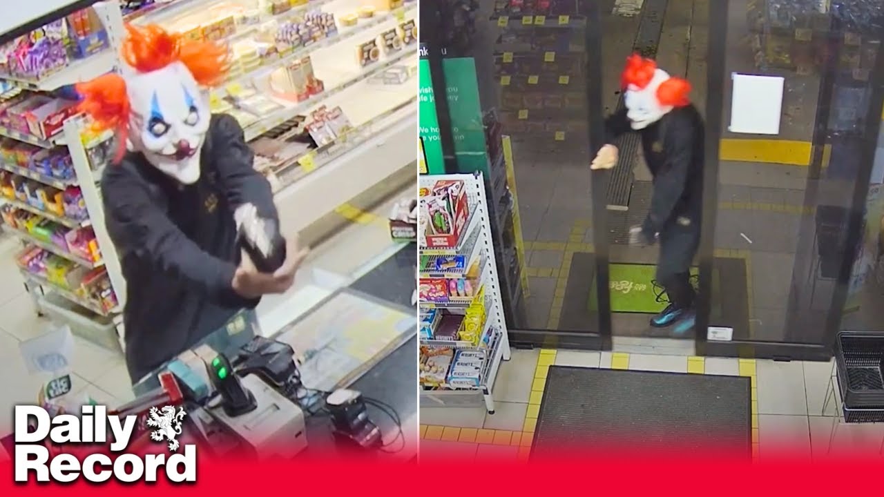 Terrifying moment 'clown' robber holds up Australian store at gunpoint ...