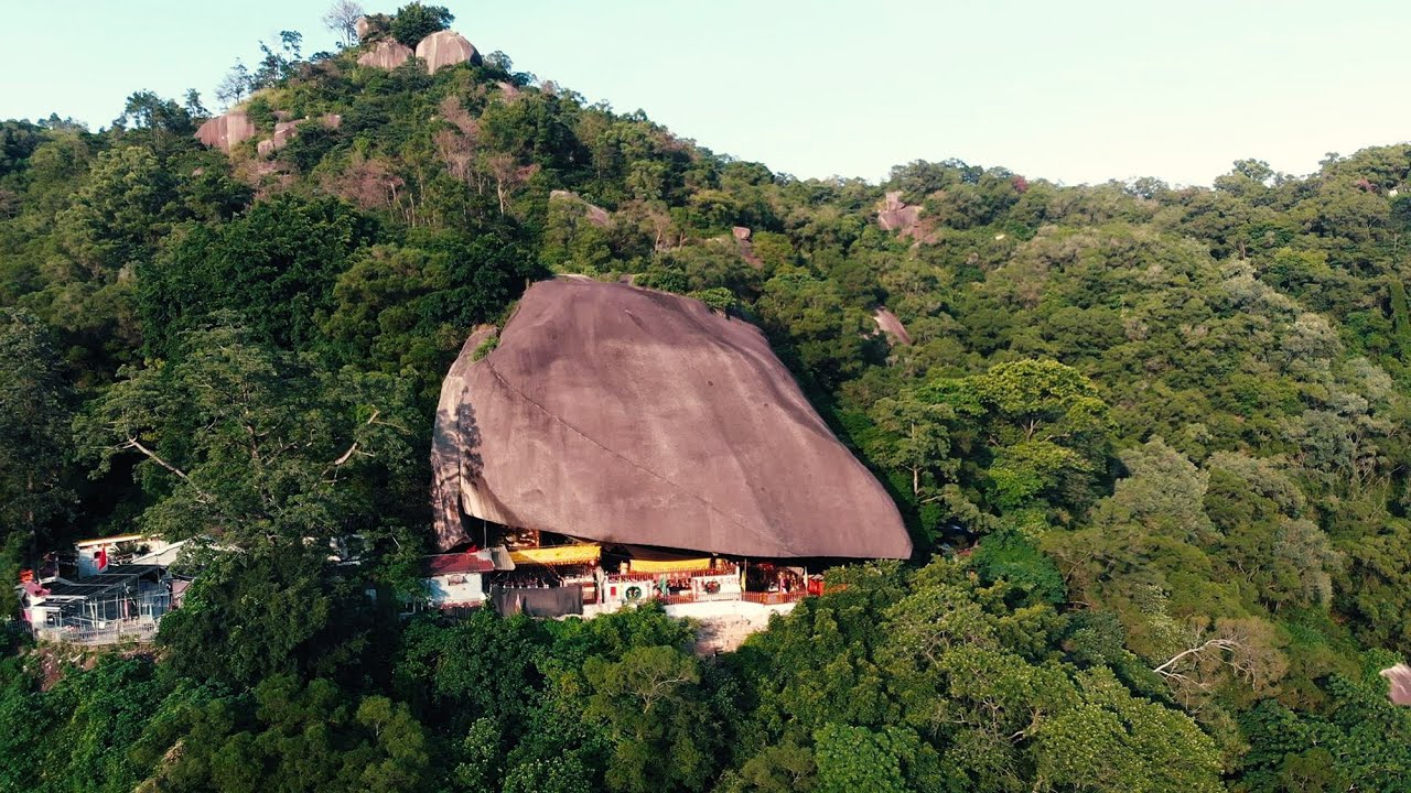 A Giant Boulder Has Sheltered This Temple for Centuries — Pilgrims Pray ...
