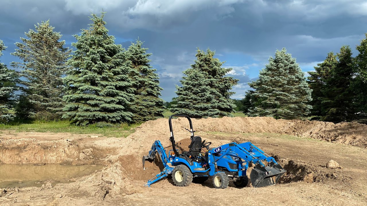 Pond dig with a sub compact tractor - YouTube
