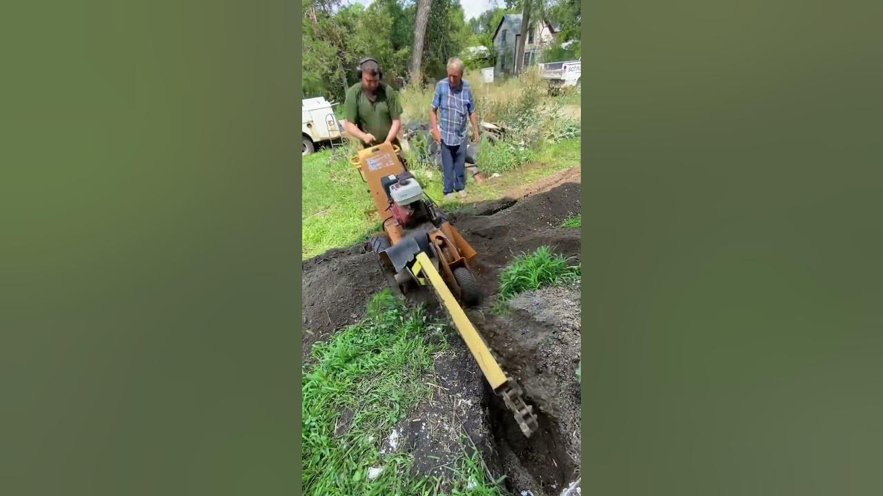 Digging a trench in preparation for underground electrical. # ...