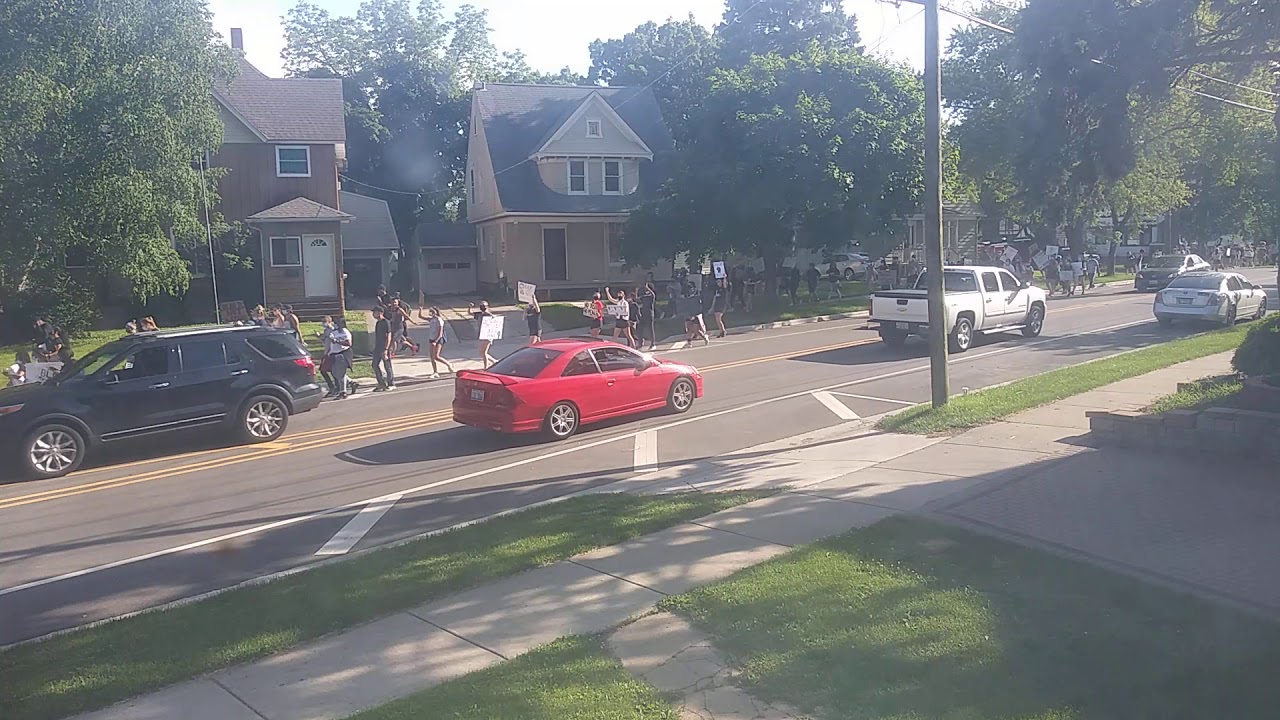 Peaceful protest parade heading east down Larkin Ave, Elgin, IL towards ...
