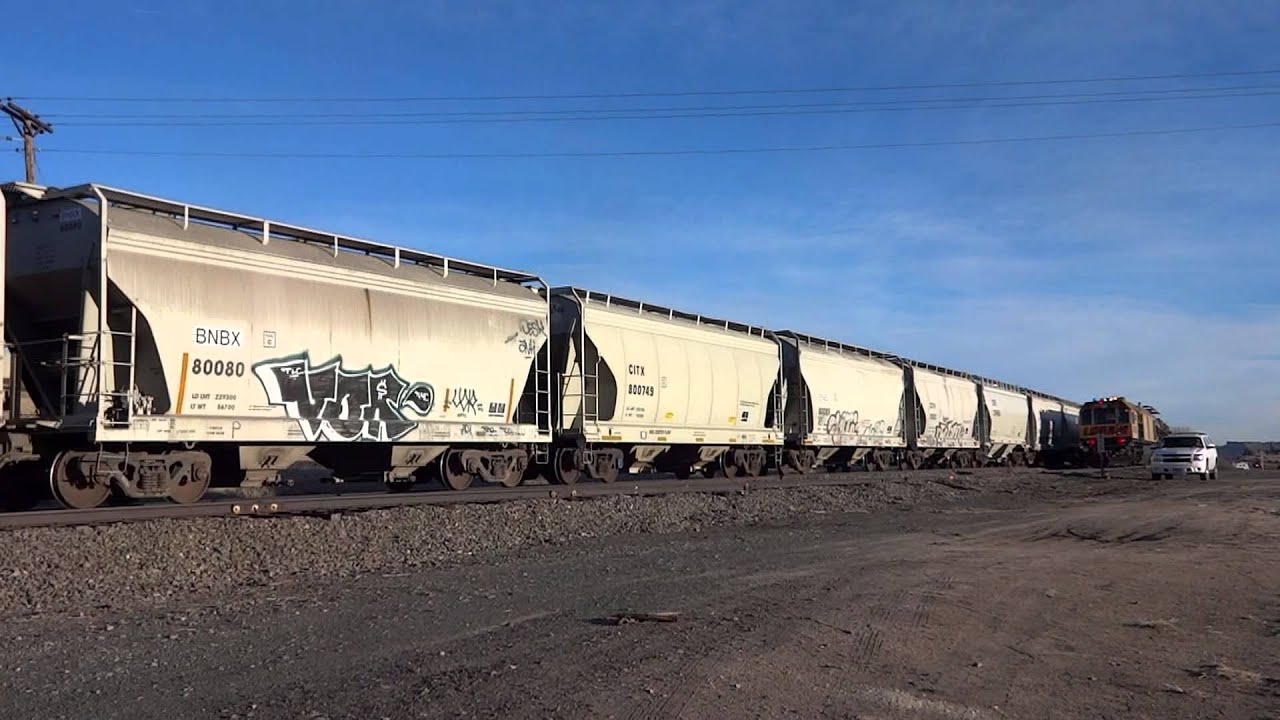 BNSF Aggregate Train passing Loram Rail Grinder in Larkspur, CO - YouTube