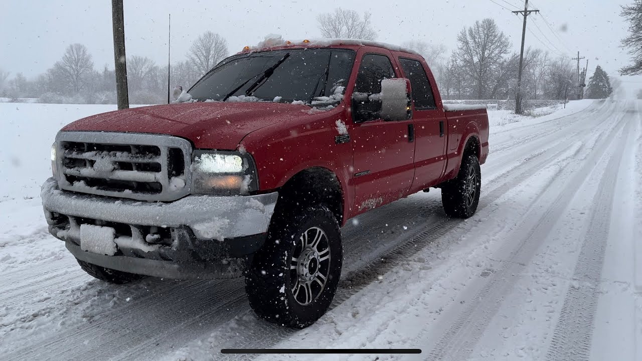 Lifted powerstroke driving through deep snow and ice - YouTube