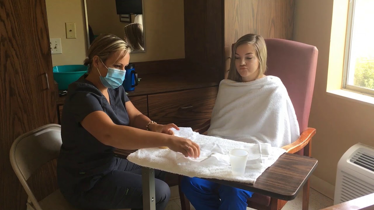 Feed a resident who is sitting in a chair - YouTube