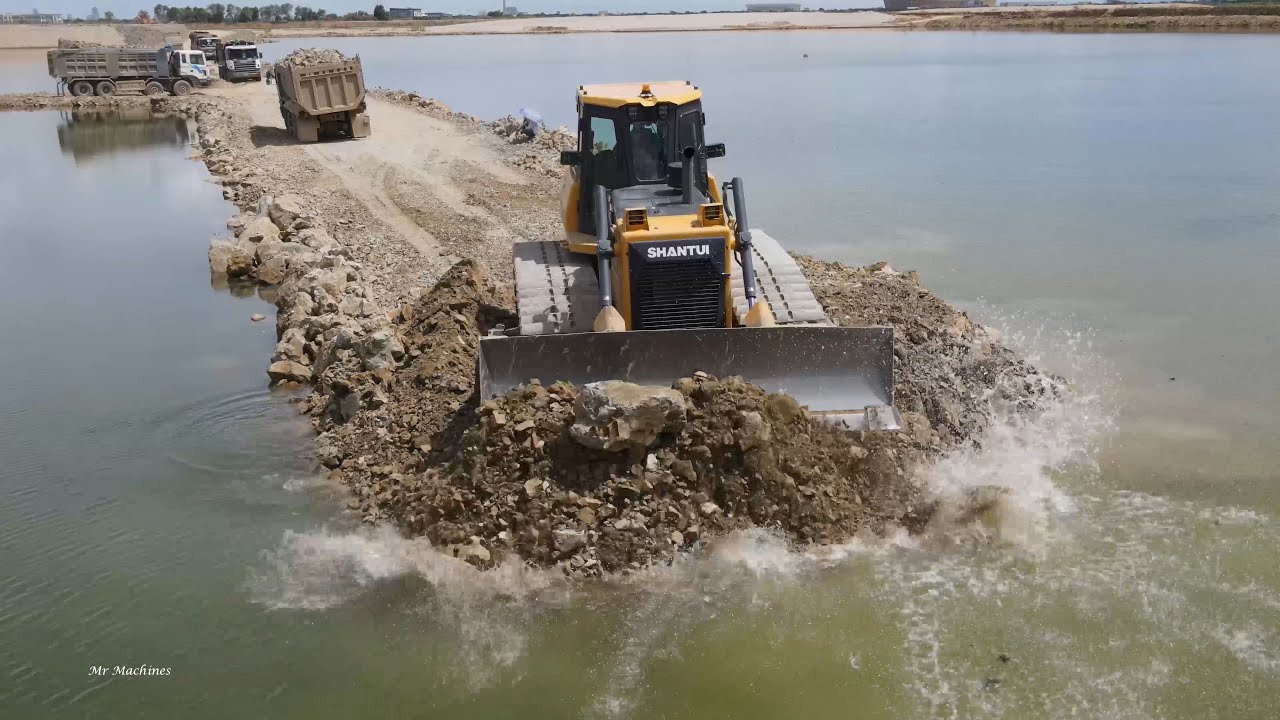 Incredible dike building across the lake mighty bulldozer push ...