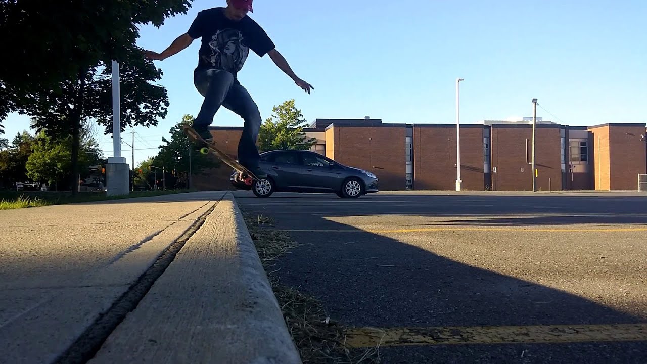 Learning how to get up a curb with different tricks - YouTube