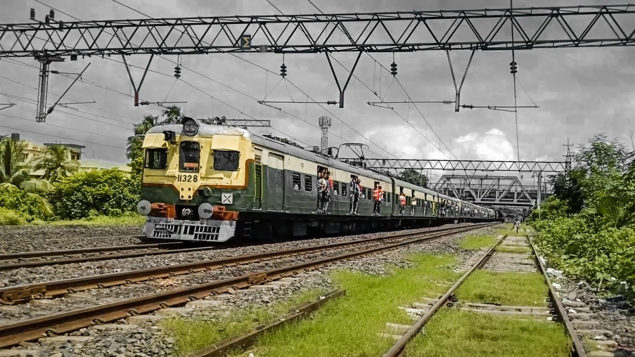 Two different types of green EMU Train action in beautiful cloudy ...