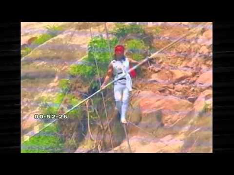 Chinese Tightrope Walker Aisikaier Survives Fall - YouTube