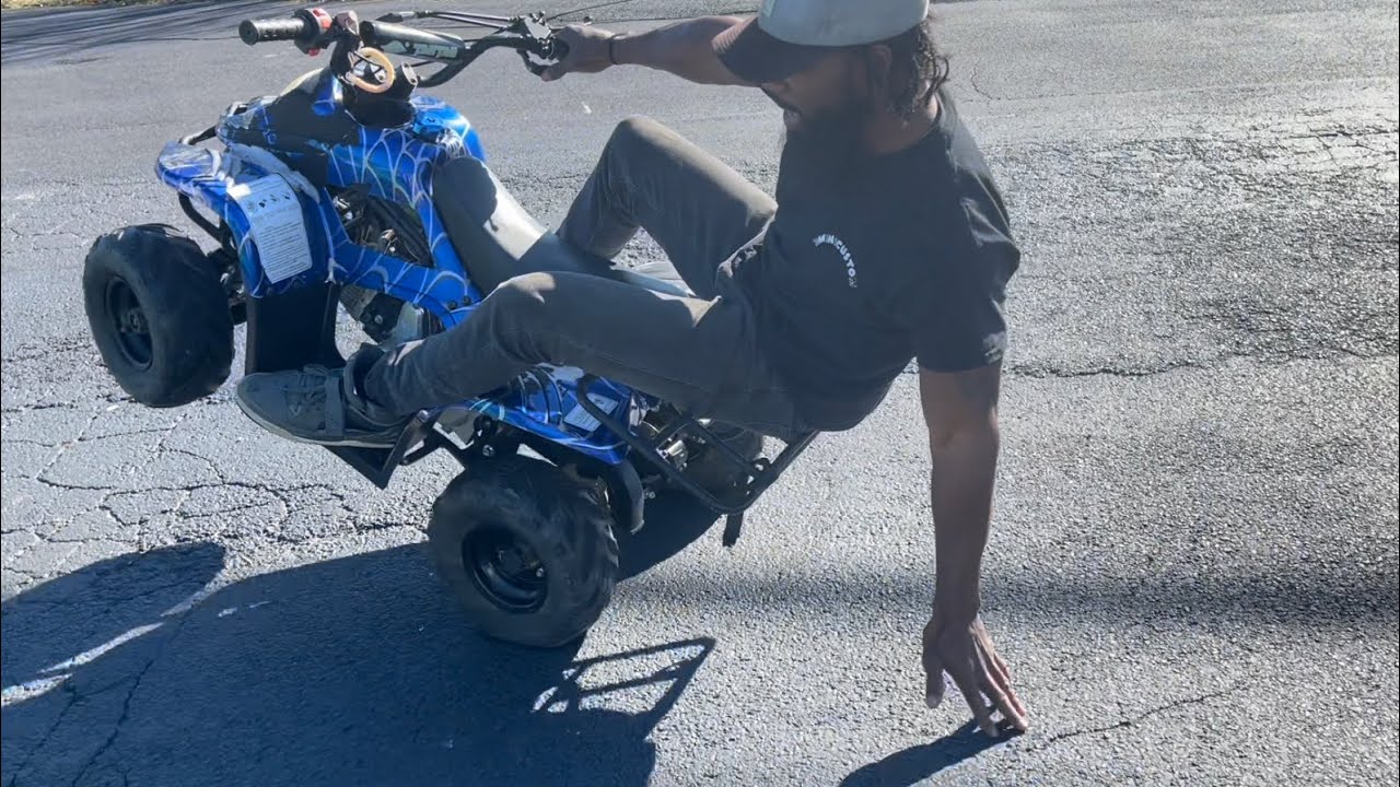 110cc 4 wheeler wheelie - YouTube