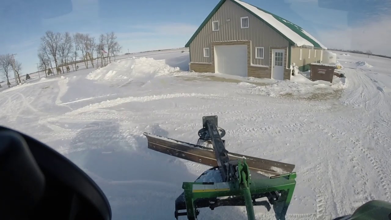 John Deere 4066R Scraping Snow with a Leon Blade - YouTube