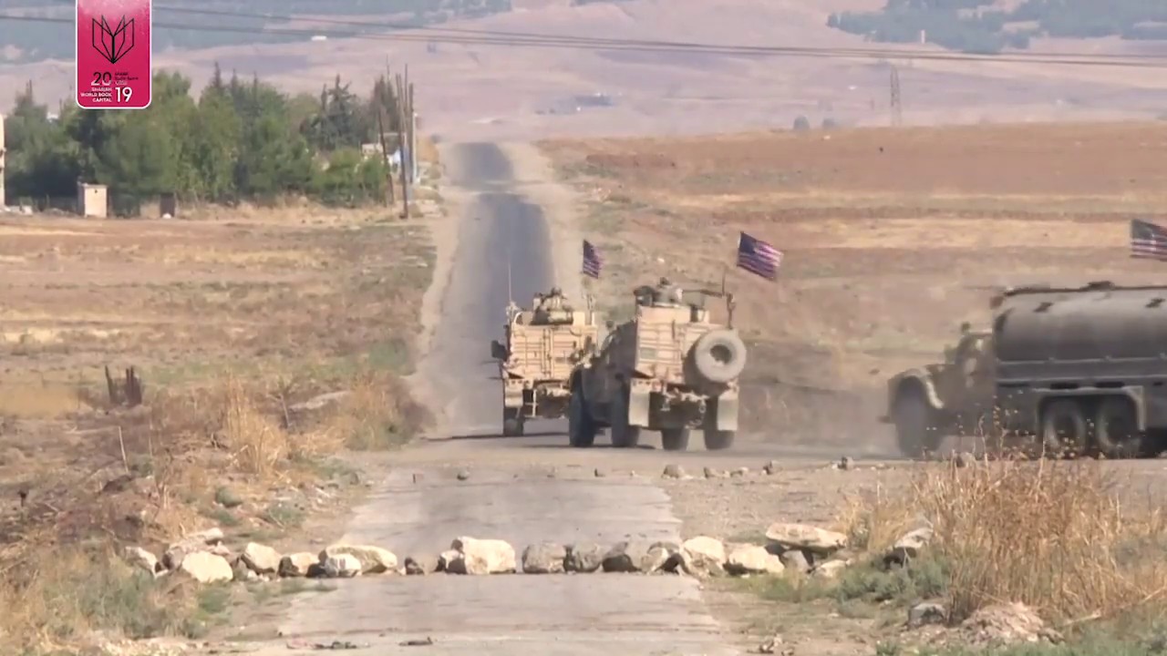 Syria: US military vehicles patrol near an oil well in Rumaylan - YouTube