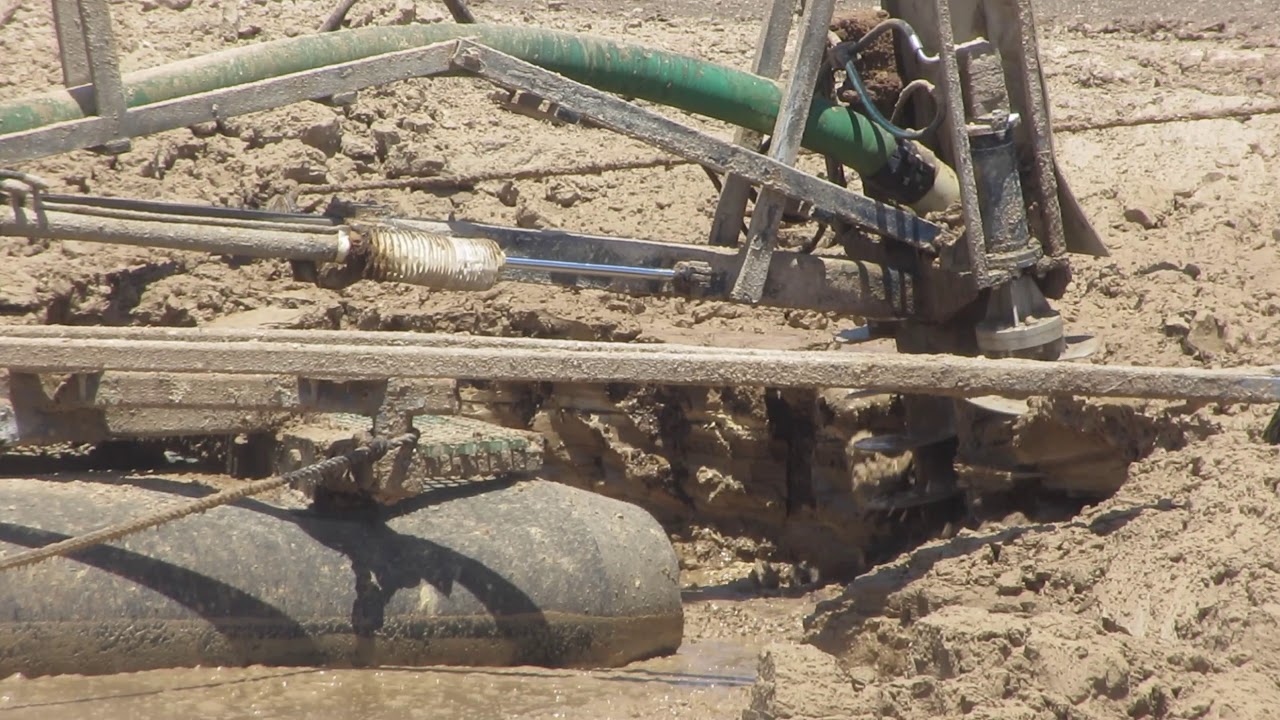 Industrial sludge pumping - phosphoric acid lagoon cleaning - YouTube