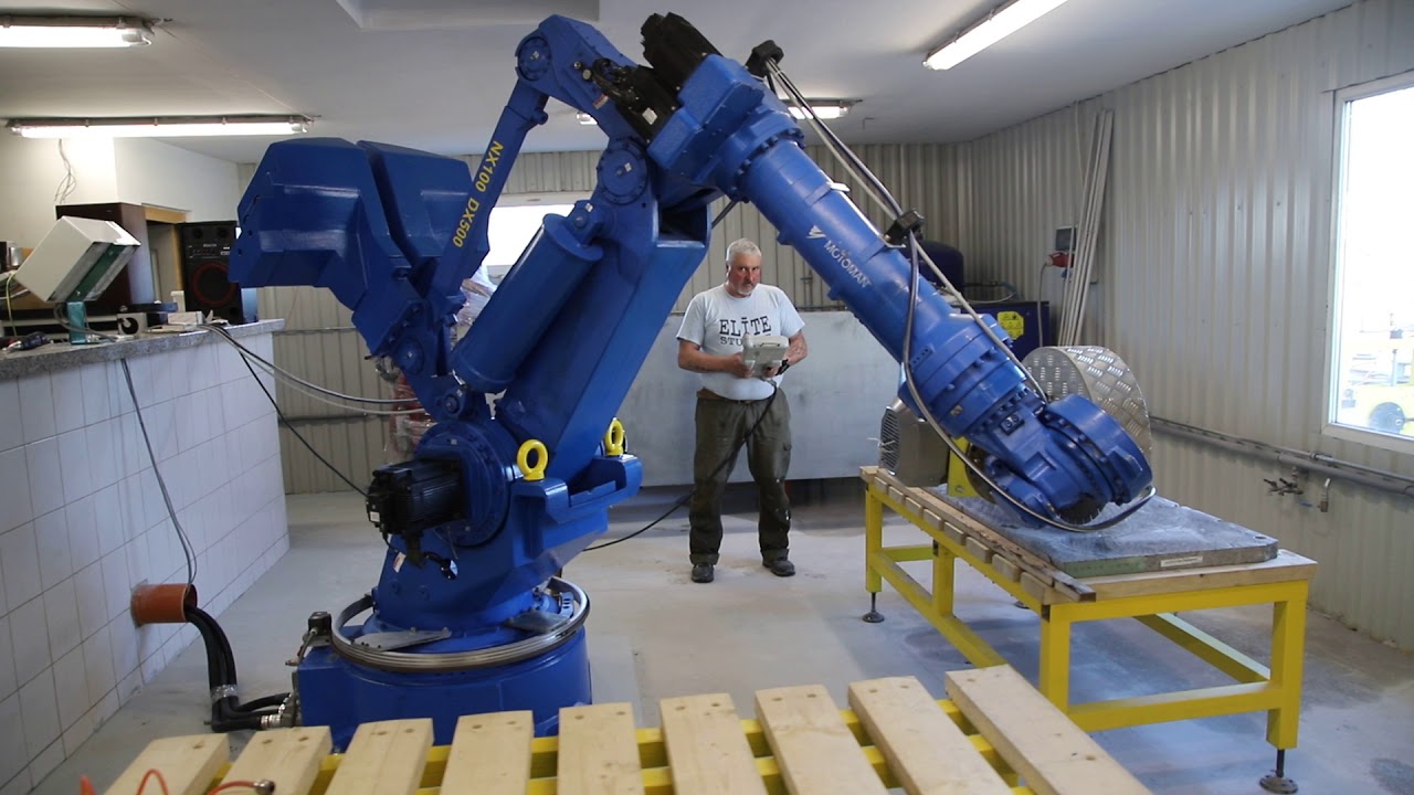 Stone cutting robot at work - YouTube