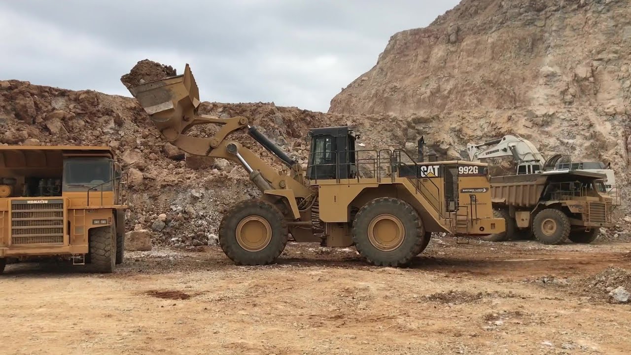 Caterpillar 992G Wheel Loader Loading Cat And Komatsu Dumpers ...