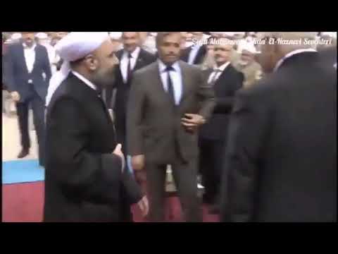 Haznevi Tarikatı sözde lideri konuşma yapıyor ve kürsüden inerken bu ülkenin adalet bakanı, milletve