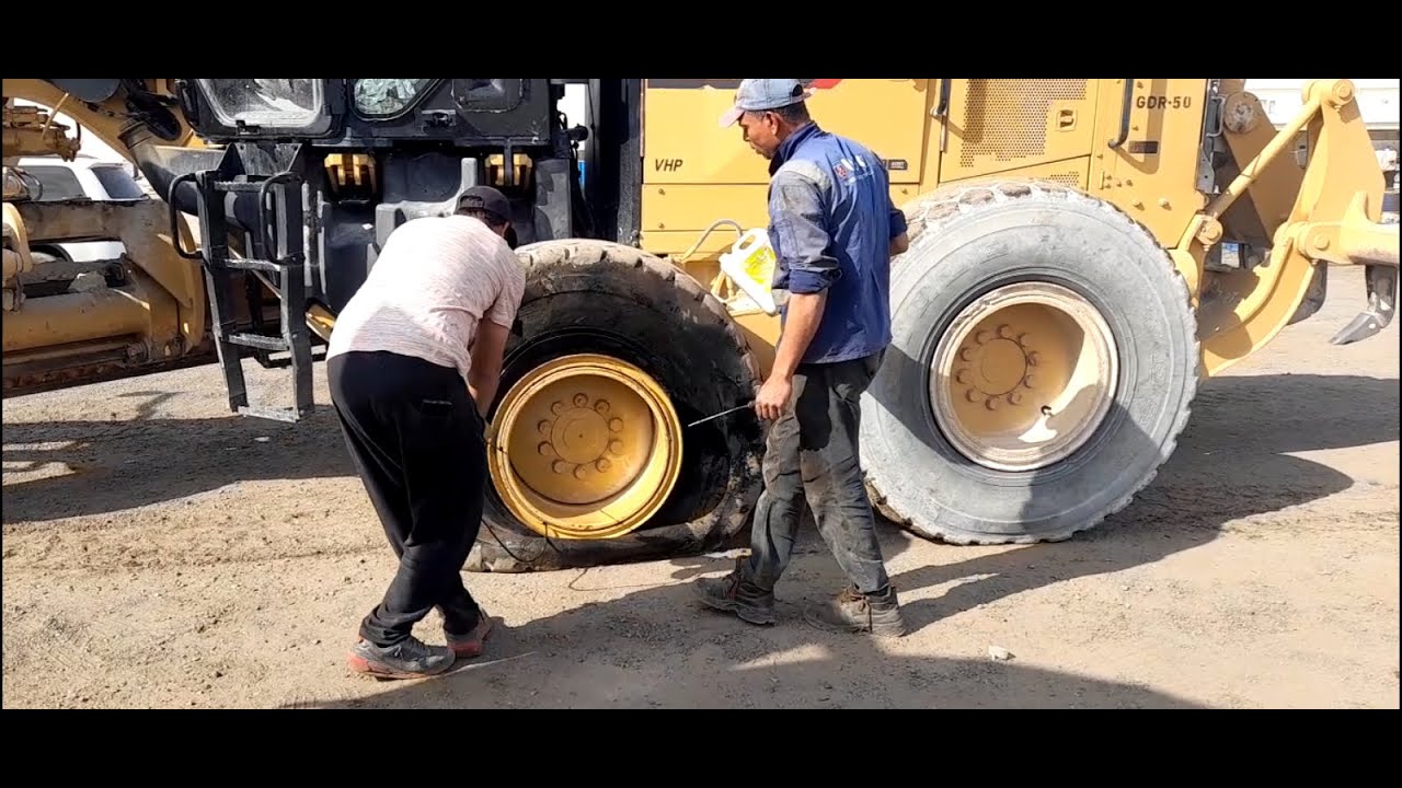 Changing Tire CATERPILLAR Road Grader 14M - YouTube