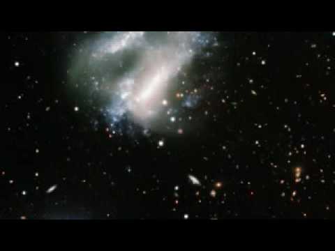 Pan over Arp 261 - YouTube