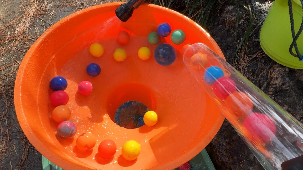 Make a water marble run course using transparent pipes and a large ...