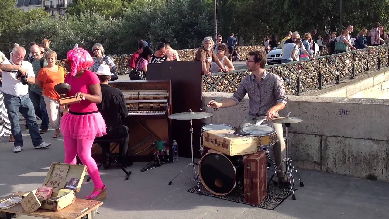 Woman in pink dancing on a street along the Seine - YouTube