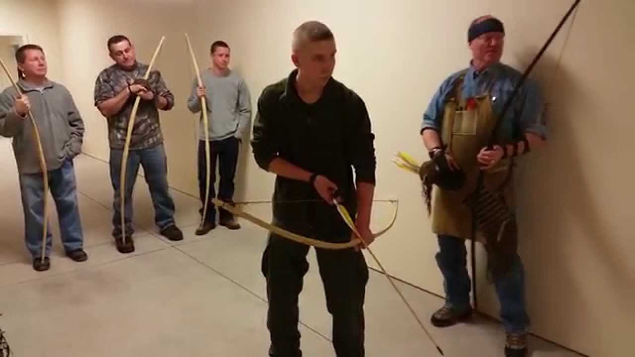 Master Bowyer Tom Turgeon watches PA students Justin, Alex, Mike and ...