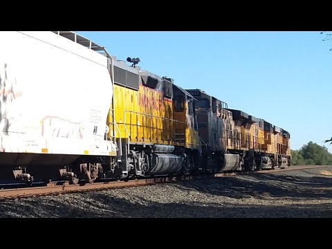 UP 8204 leads a southbound freight train with a nice crew - YouTube
