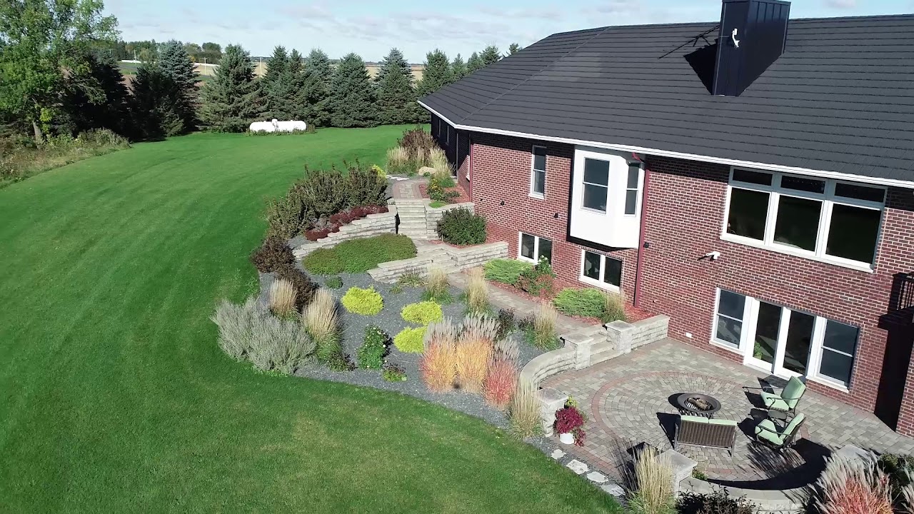 This project includes a beautiful mix of hardscapes! - YouTube