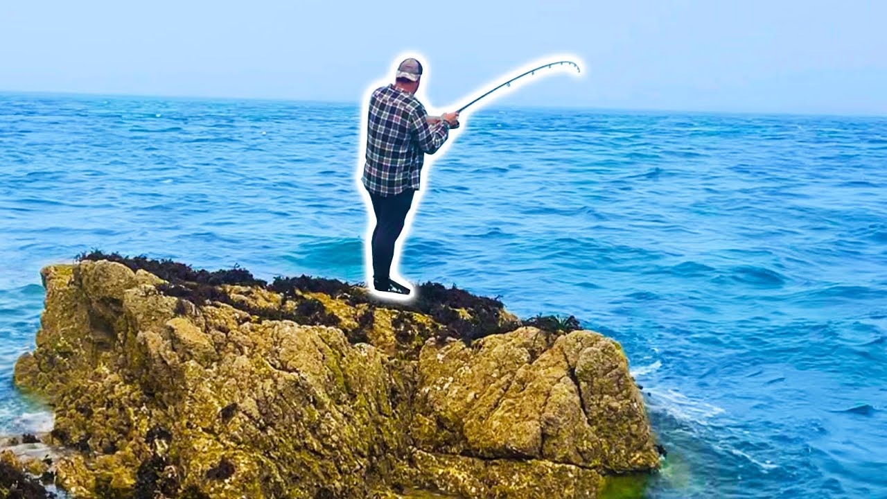 Fishing off the rocks - Anglesey North Wales - YouTube