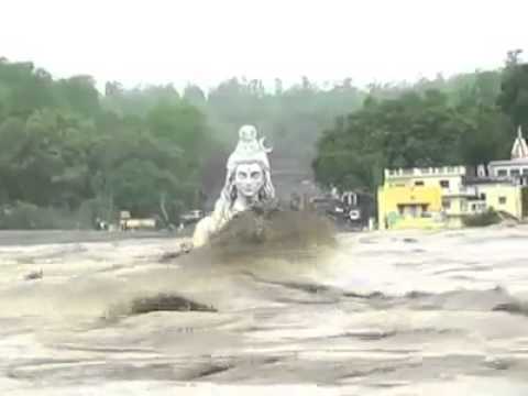 himalayan tsunami flood in rishikesh, utharakhand. shiva statue against ...
