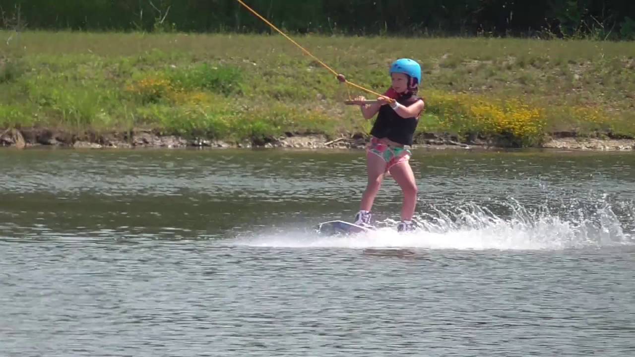 9 years old girl wakeboarding on a full size wakeboard cable - YouTube