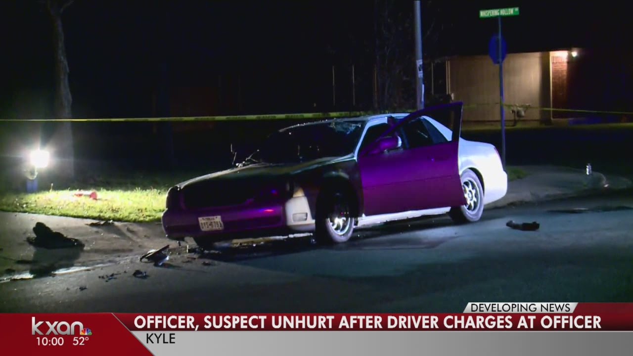 Kyle police officer shoots car as it charges at him; no one hurt - YouTube