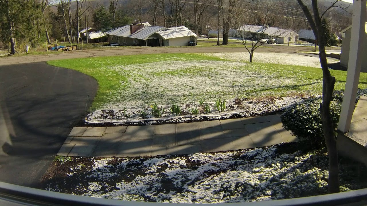 Sun Melting Snow on Lawn - YouTube