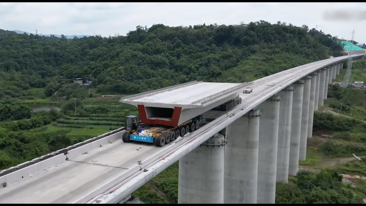 Girder trucks transporting 800 tons of high-speed rail girders on the ...