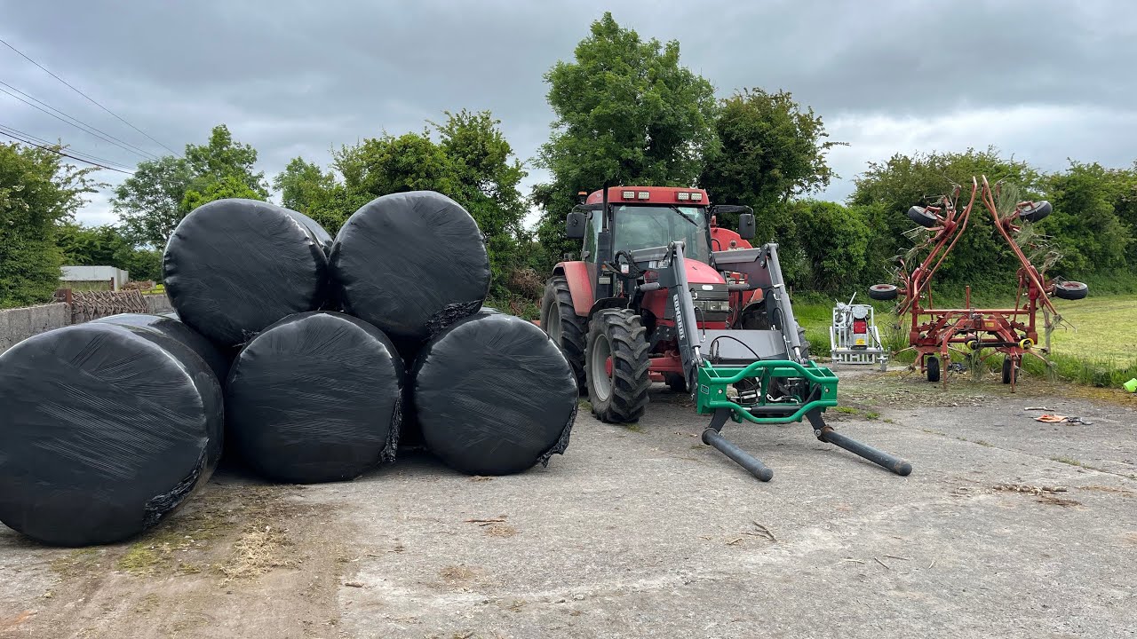 Silage 2024 - making a start. Mowing, tedding, balling & stacking - YouTube