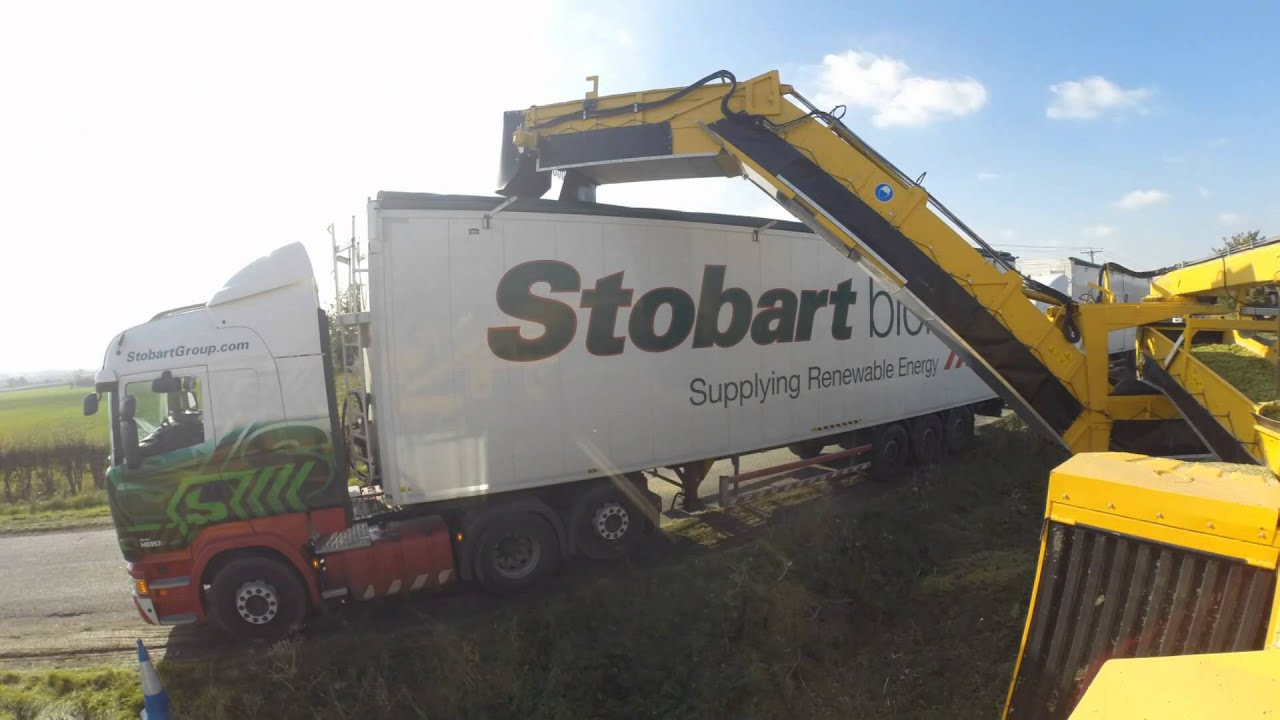 loading maize into lorries with Bunker Maus - YouTube