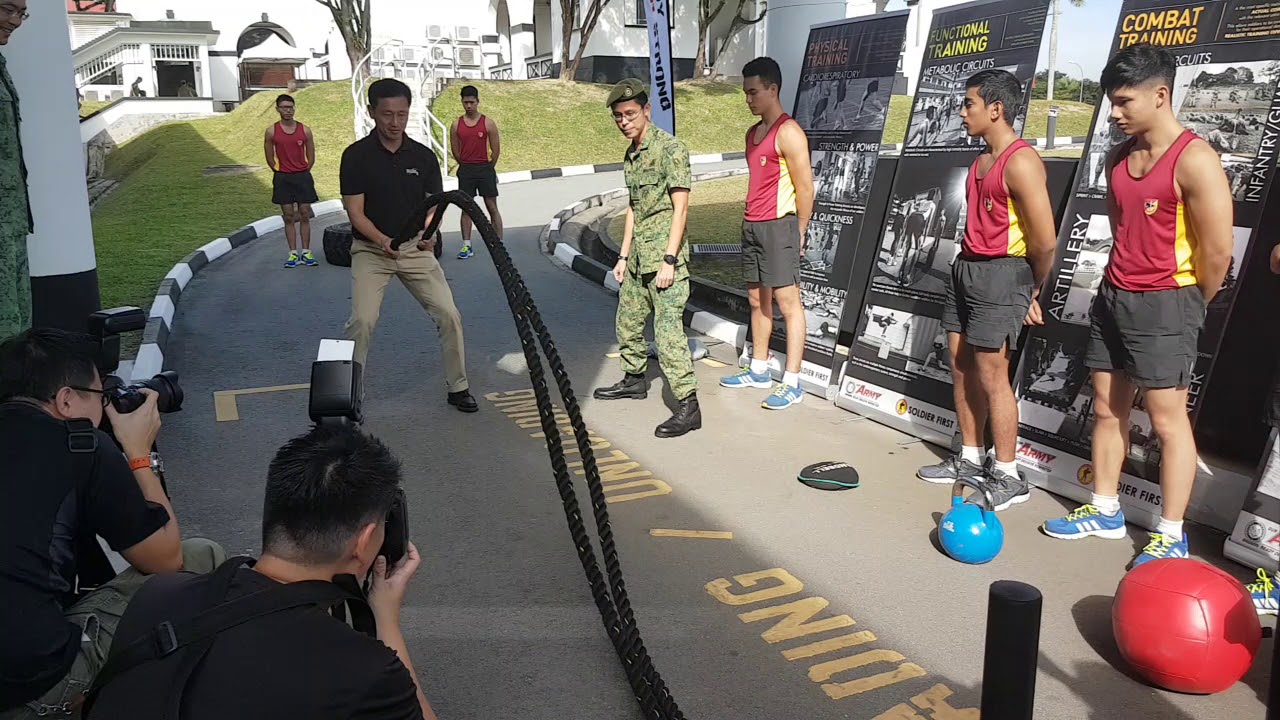 Ong Ye Kung trying out the battle ropes exercise at the CESP opening ...