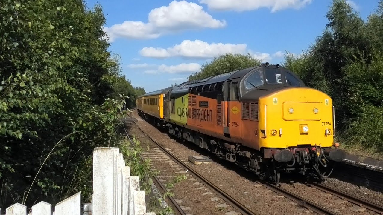 Tractors on the TEST train, speed through the 'FOREST' at Northwich ...