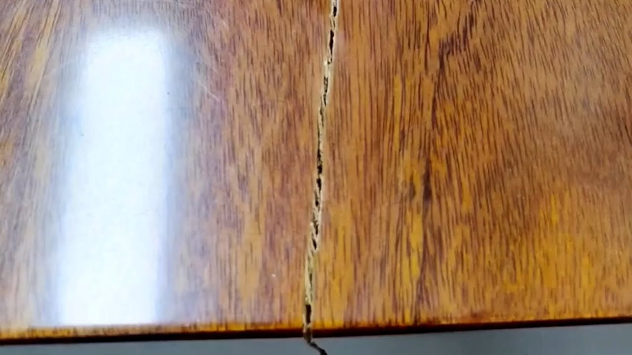 The old master's skills are excellent, hand repairing the cracked table ...