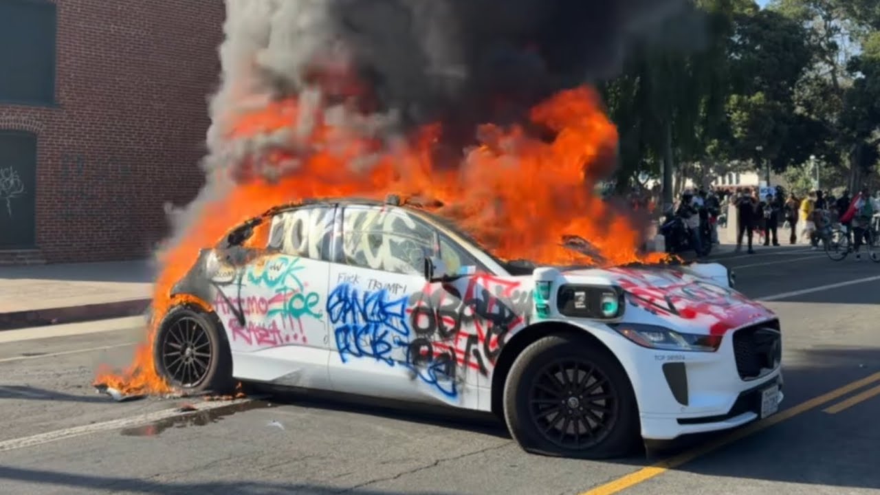 Waymo On Fire in Los Angeles At ICE Protest - YouTube