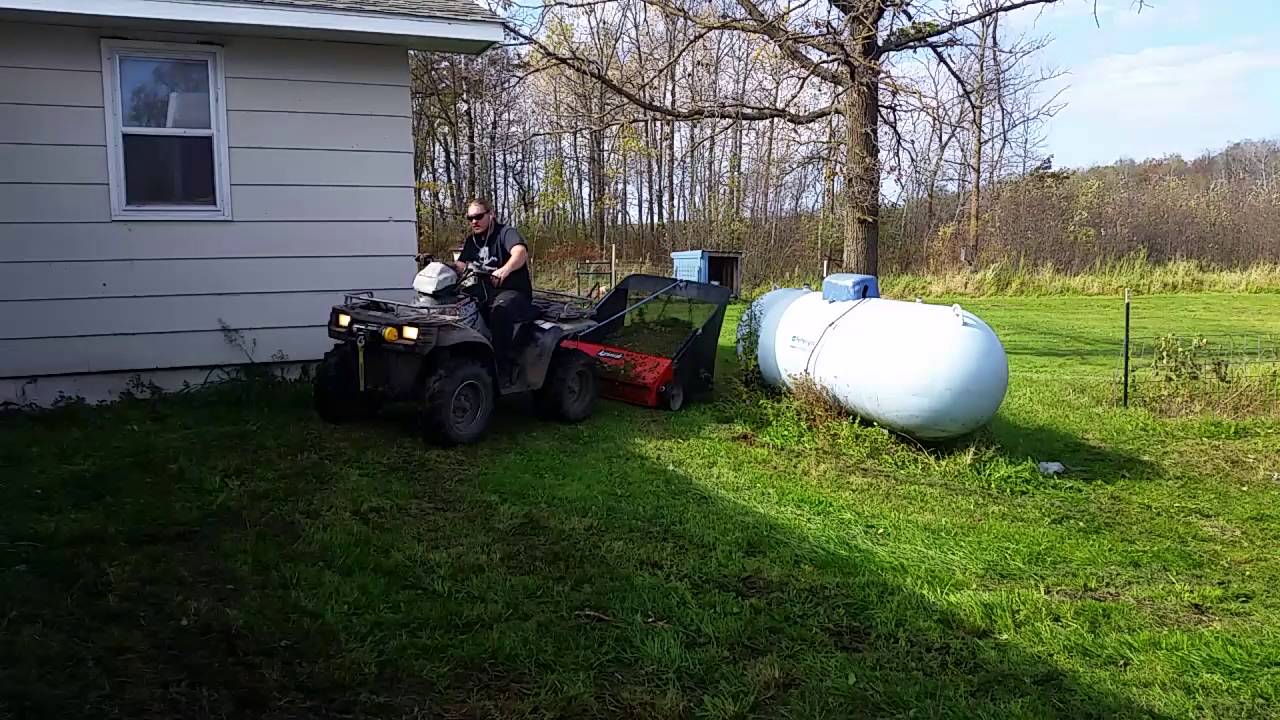 sweeping the lawn with the agri fab atv lawn sweeper - YouTube
