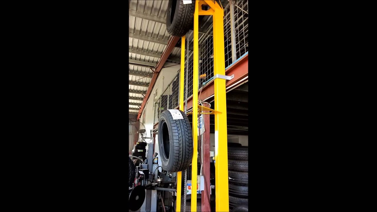 Tyre elevator in action - YouTube