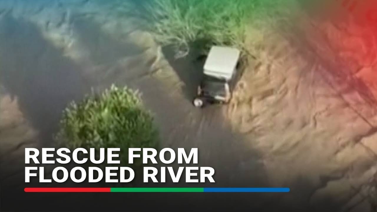 Family rescued from car stuck in flooded river - YouTube