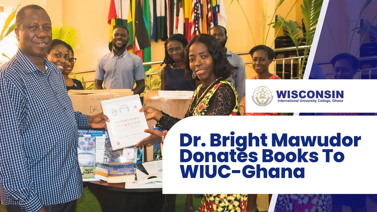 Dean of Business School Donate Books to WIUC Library - YouTube