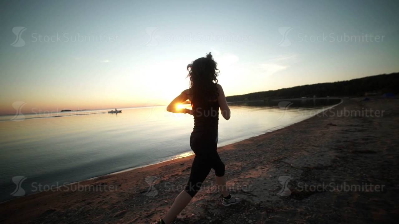 Athletic women running outdoors on promenade at sunset near ocean - YouTube